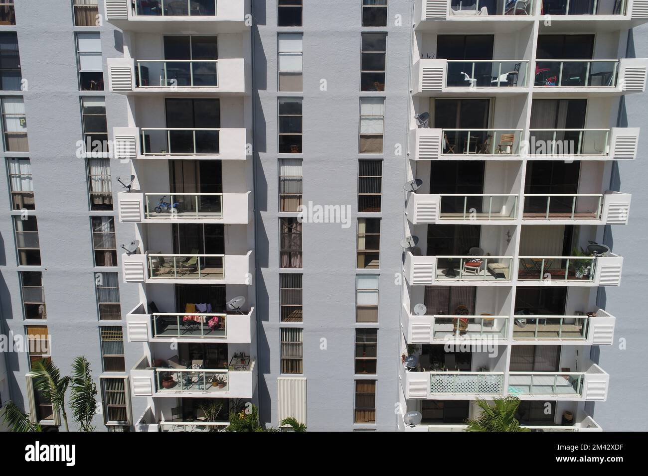 A view of an apartment building with balconies during sunrise Stock ...