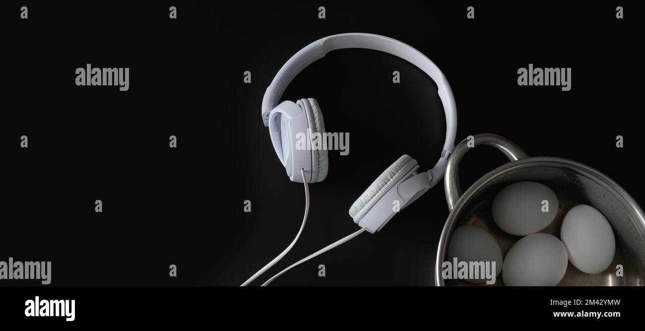 Easter concept, banner format . Easter eggs, headphones, smartphone ...