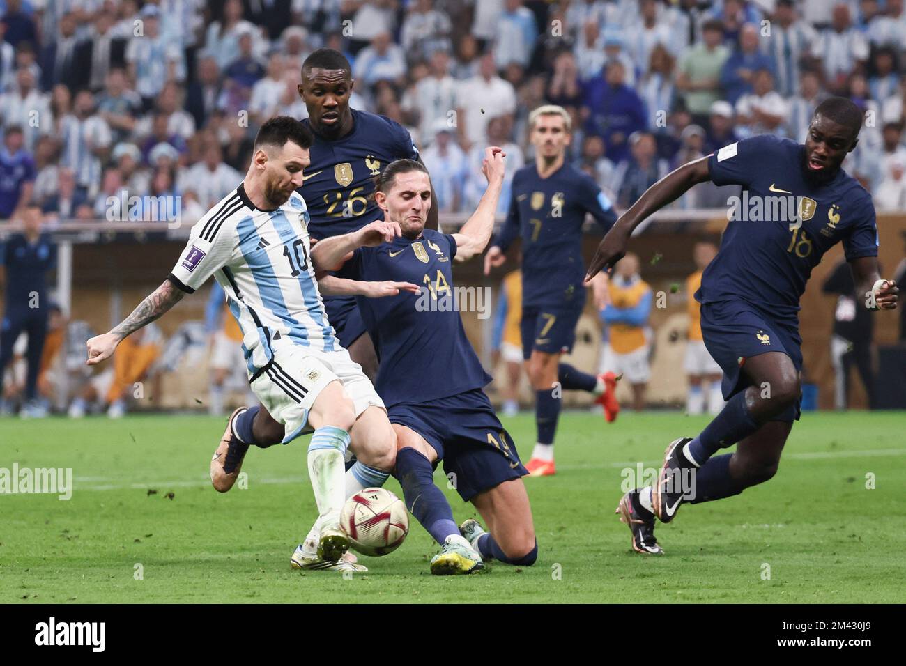 Lusail, Qatar. 18th Dec, 2022. Adrien Rabiot (3rd L) of France defends ...