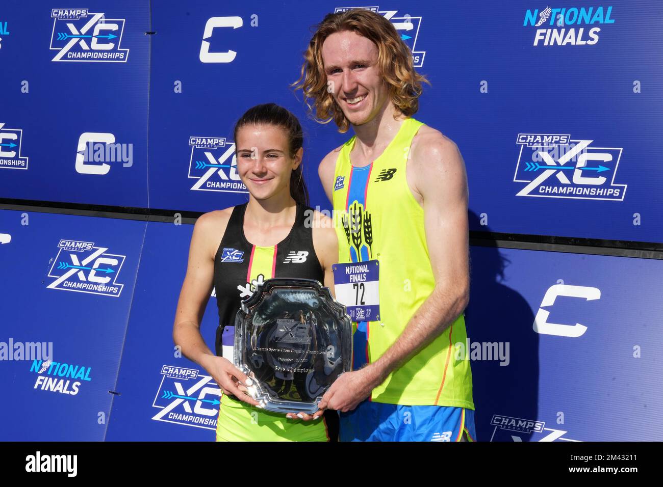 Girls winner Karrie Baloga (left) and boys winner Kole Mathison pose ...