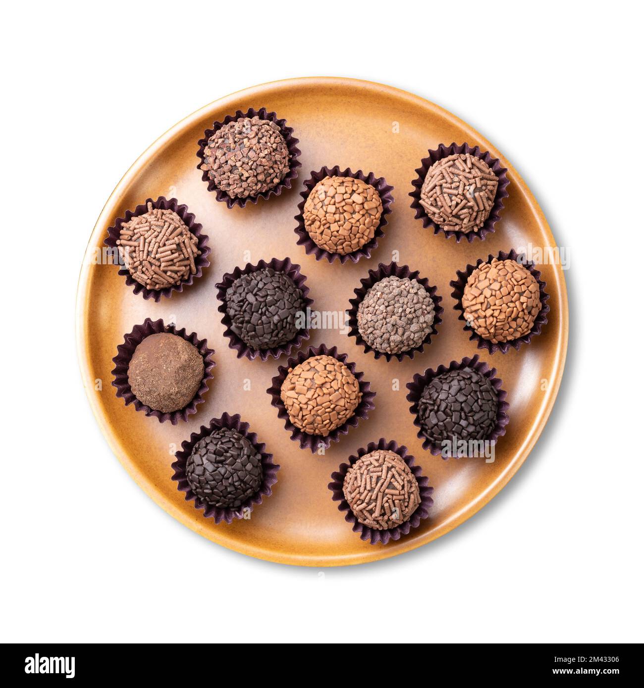 Typical brazilian brigadeiros, various flavors on a brown plate ...