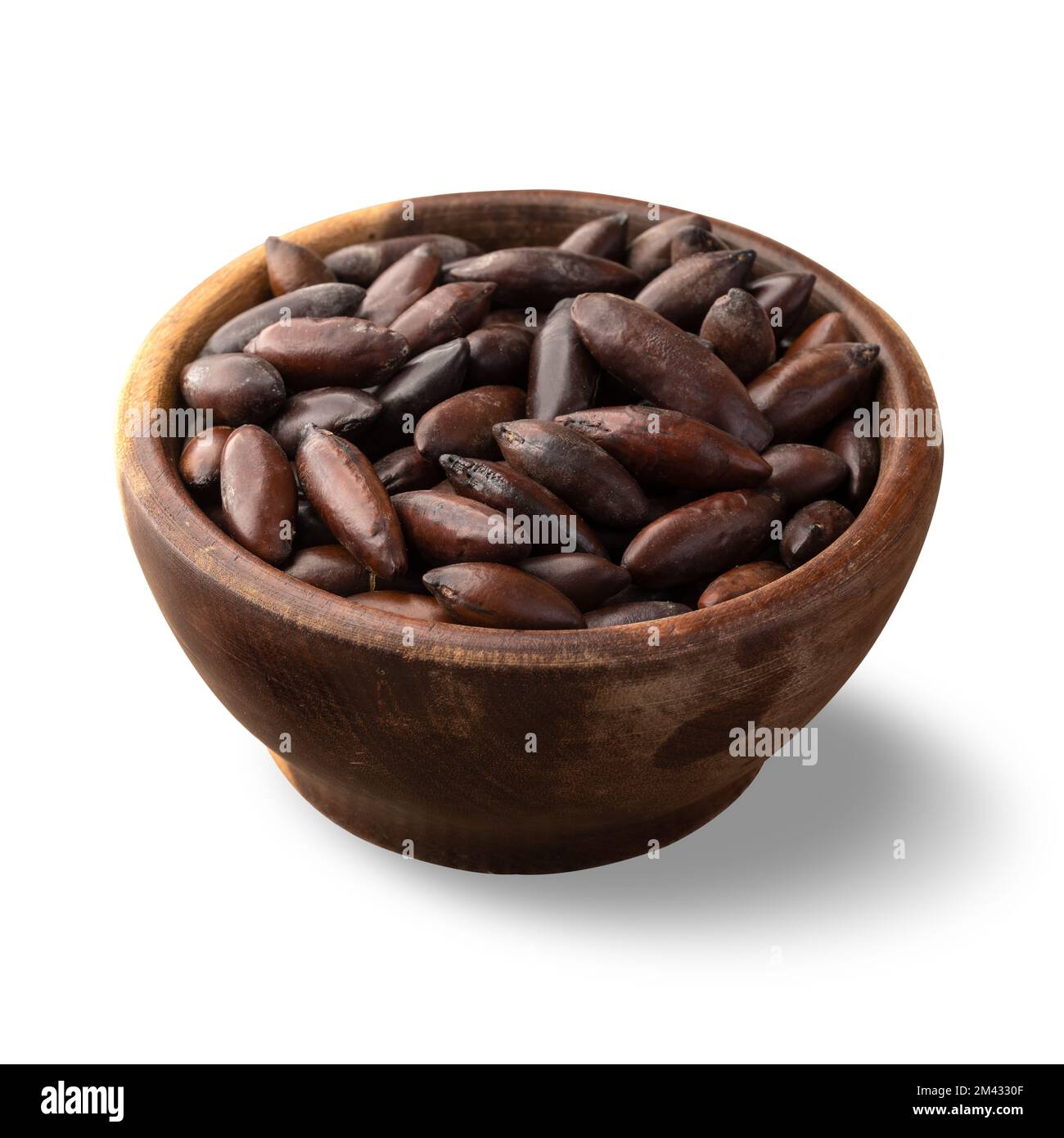 Bowl of brazilian baru nuts isolated over white background Stock Photo ...