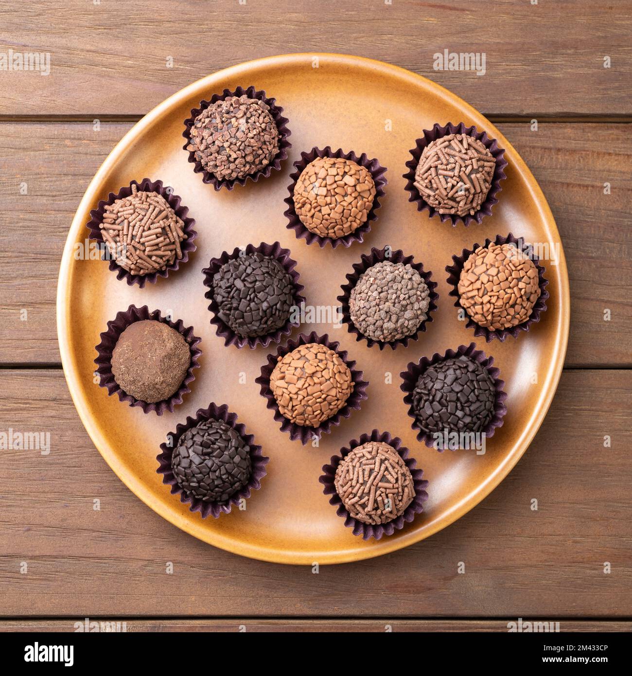 Typical brazilian brigadeiros, various flavors on a brown plate Stock ...