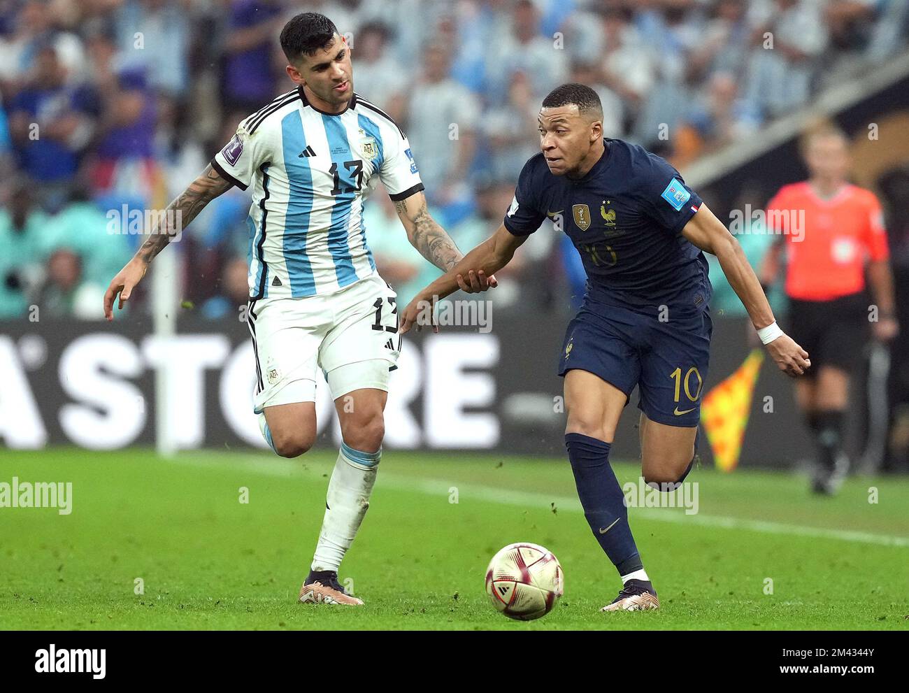Argentina's Cristian Romero (left) and France's Kylian Mbappe battle ...