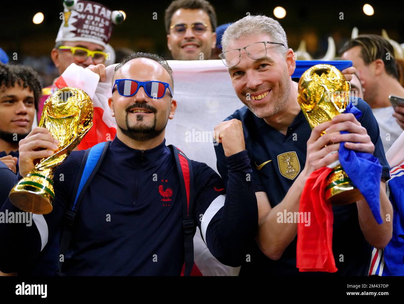 France fans hold replicas of the FIFA World Cup trophy during the FIFA ...