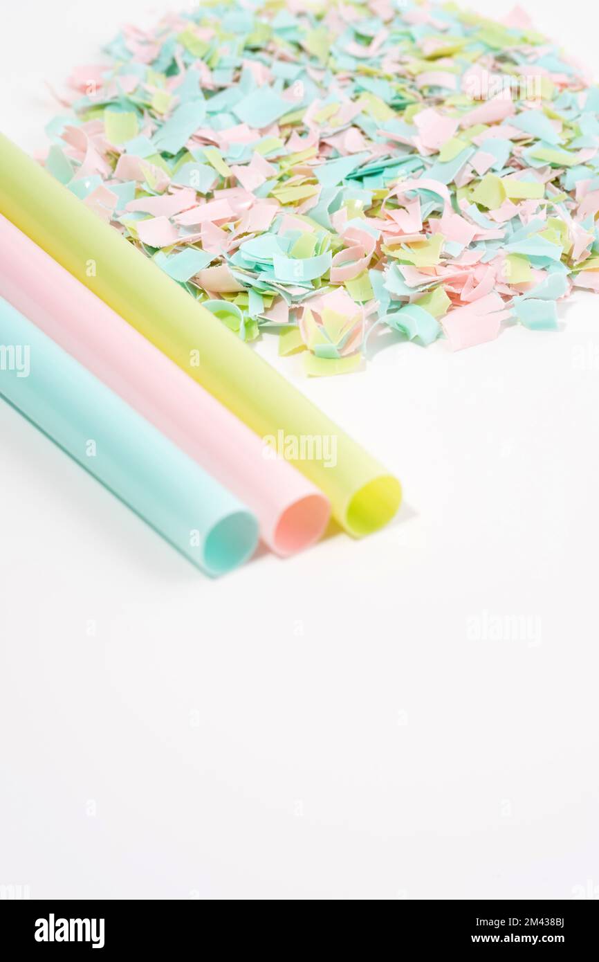 Drinking straws and microplastics on a white background. Impact of ...