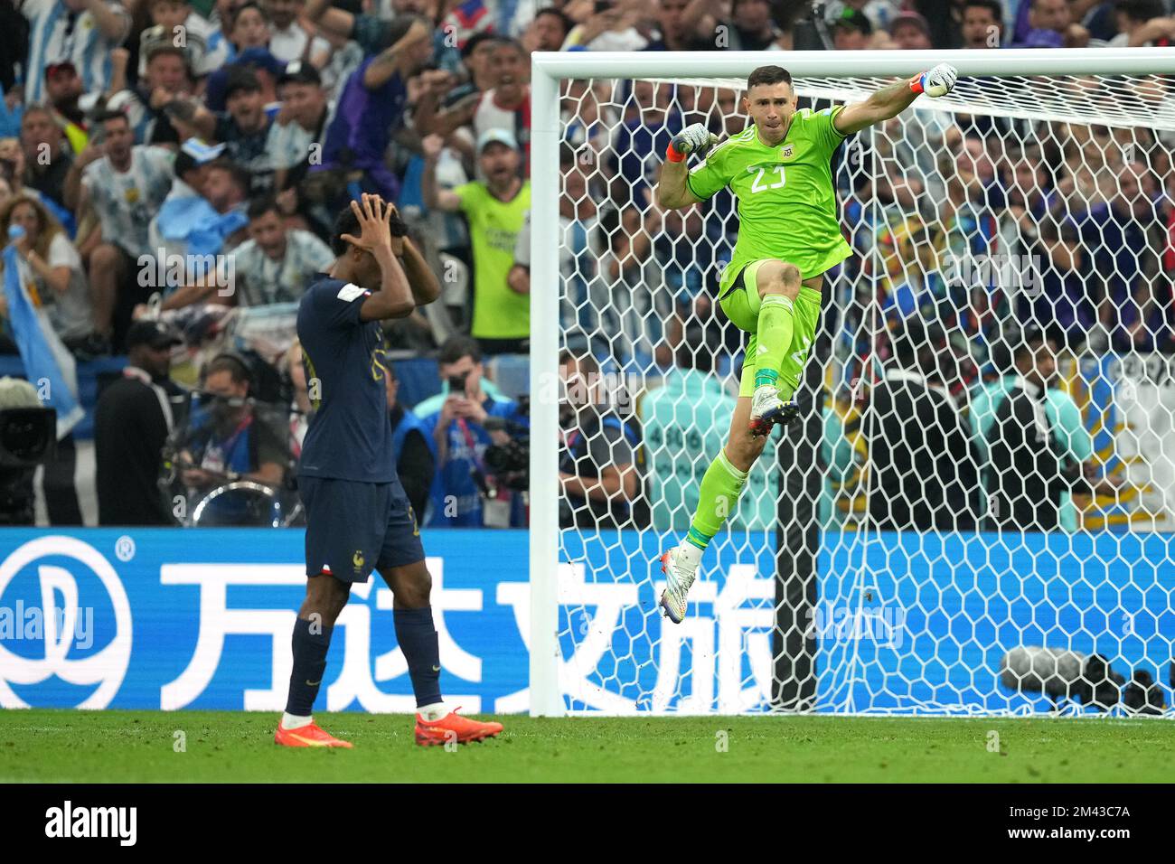 Argentina goalkeeper Emiliano Martinez (right) celebrates after saving ...