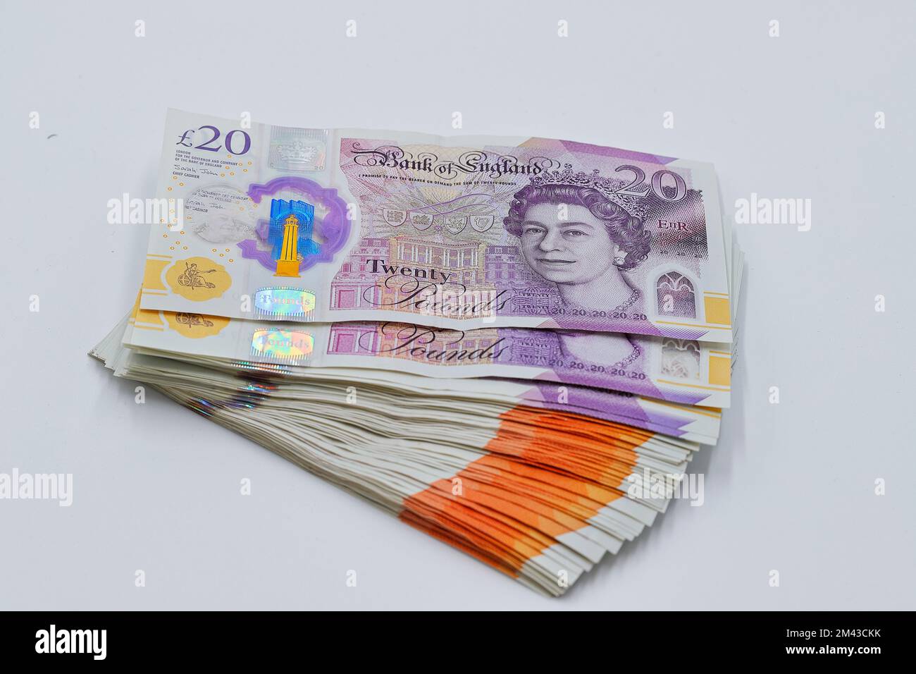 A pile of polymer Bank of England £10 & £20 notes Stock Photo - Alamy