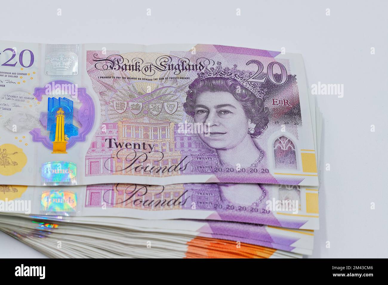 A pile of polymer Bank of England £10 & £20 notes Stock Photo - Alamy