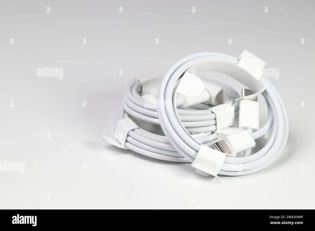New white USB type charger cable, compatible for many devices, wrapped ...