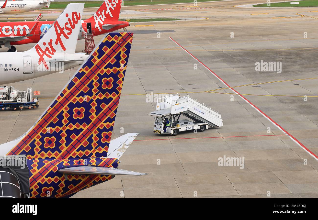 Mobile Passenger Boarding Stairs move for services at Apron near aircraft bay Stock Photo - Alamy
