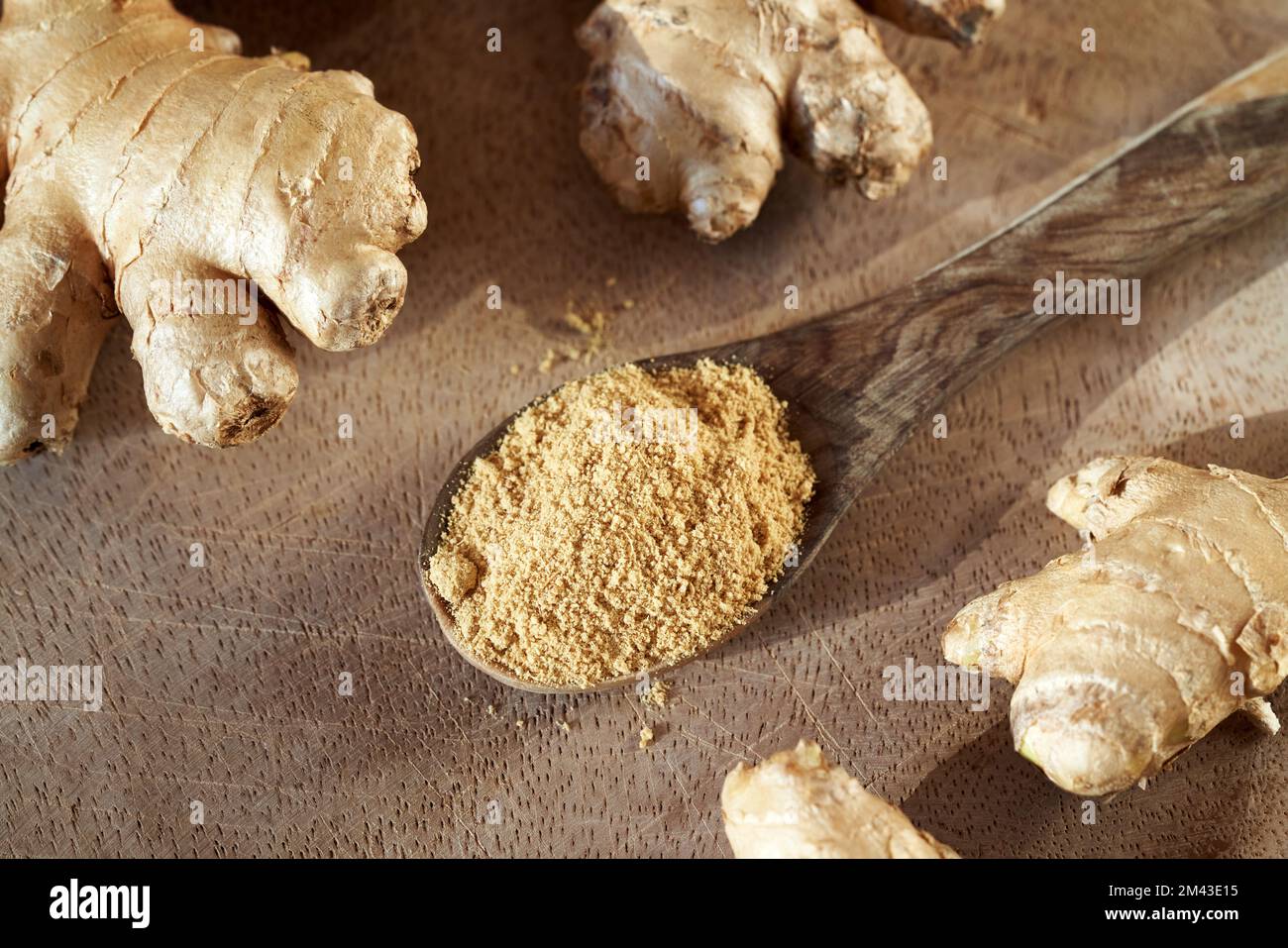 Ginger powder and fresh root, top view Stock Photo - Alamy