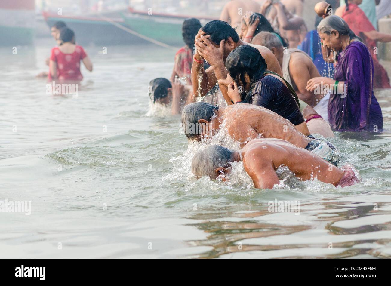 Morning hours are busy with pilgrims at the ghats Stock Photo - Alamy