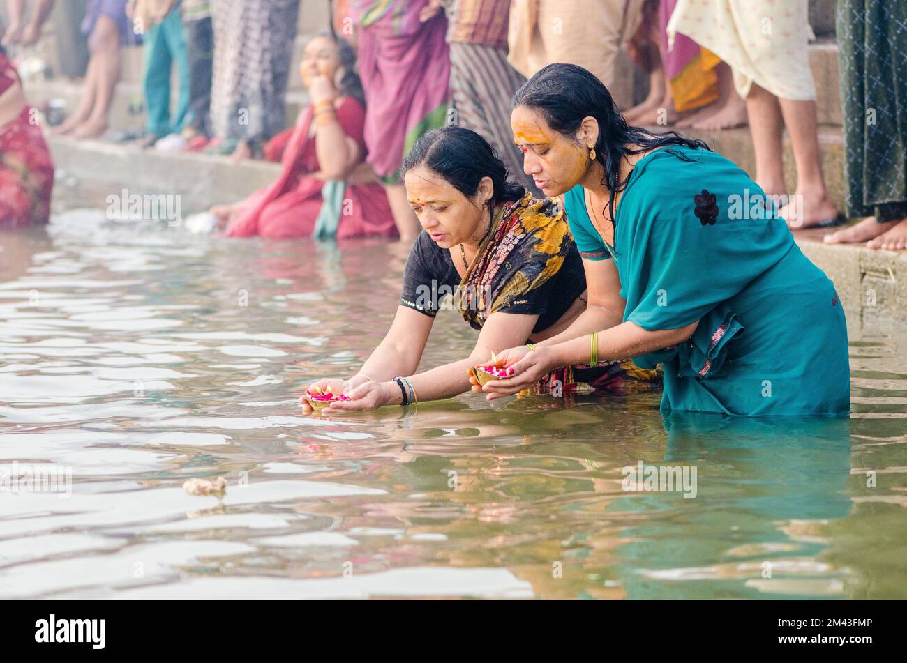 Morning hours are busy with pilgrims at the ghats Stock Photo - Alamy