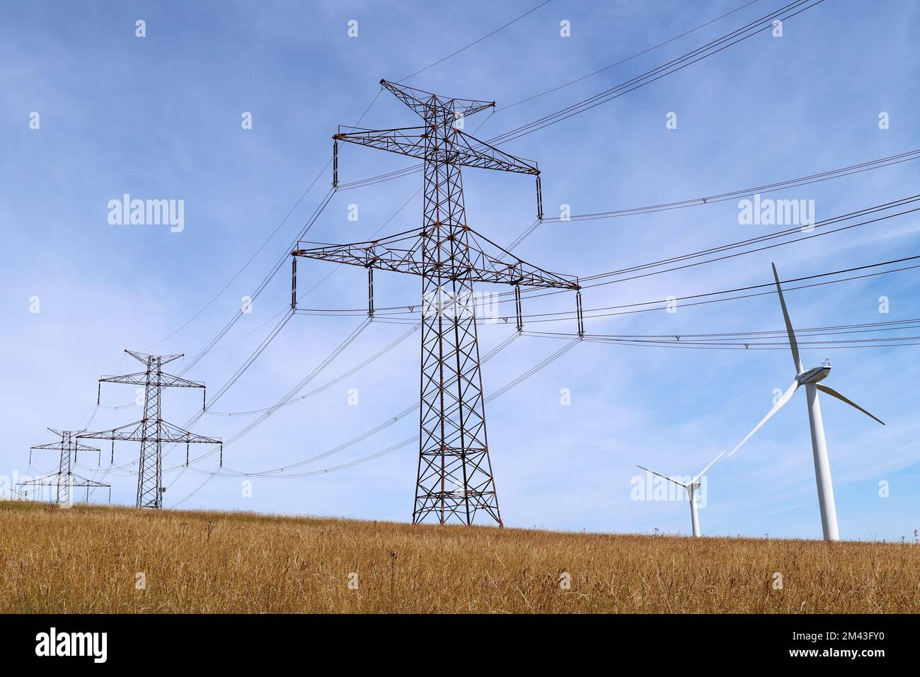 High voltage power lines and wind power plant Stock Photo - Alamy