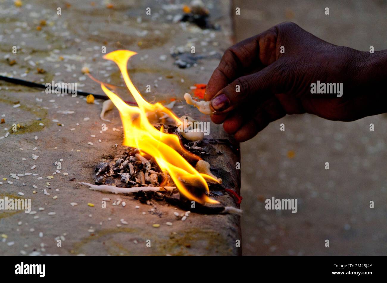 Many different rituals get performed at the ghats Stock Photo - Alamy
