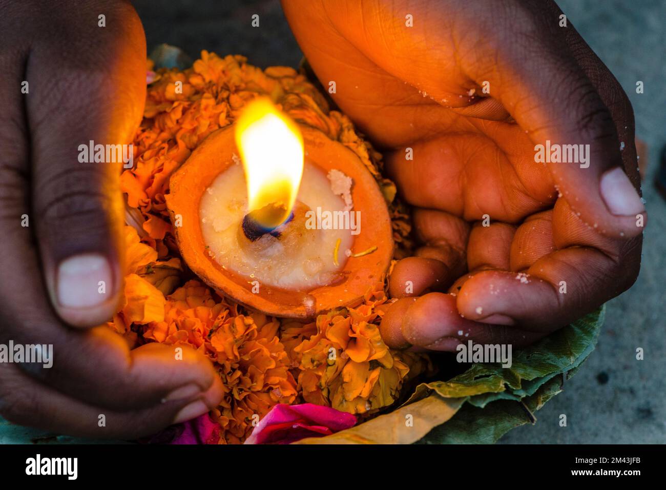 Many different rituals get performed at the ghats Stock Photo - Alamy