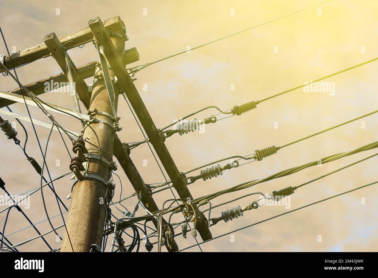concrete pole with electrical power, telephony and fiber optic cabling ...