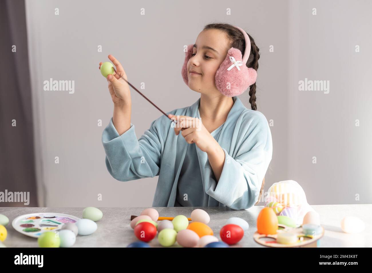 easter holiday celebration, cute girl, happy small child near colorful ...