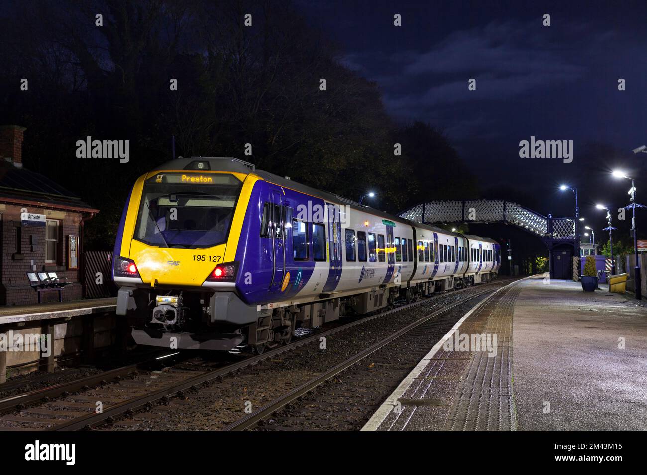 Northern Rail class 195 train at Arnside railway station at night Stock ...