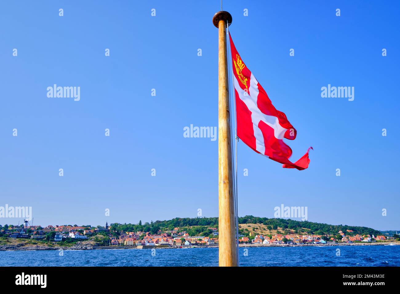 Flying Danish flag at the stern of an excursion boat and picturesque ...