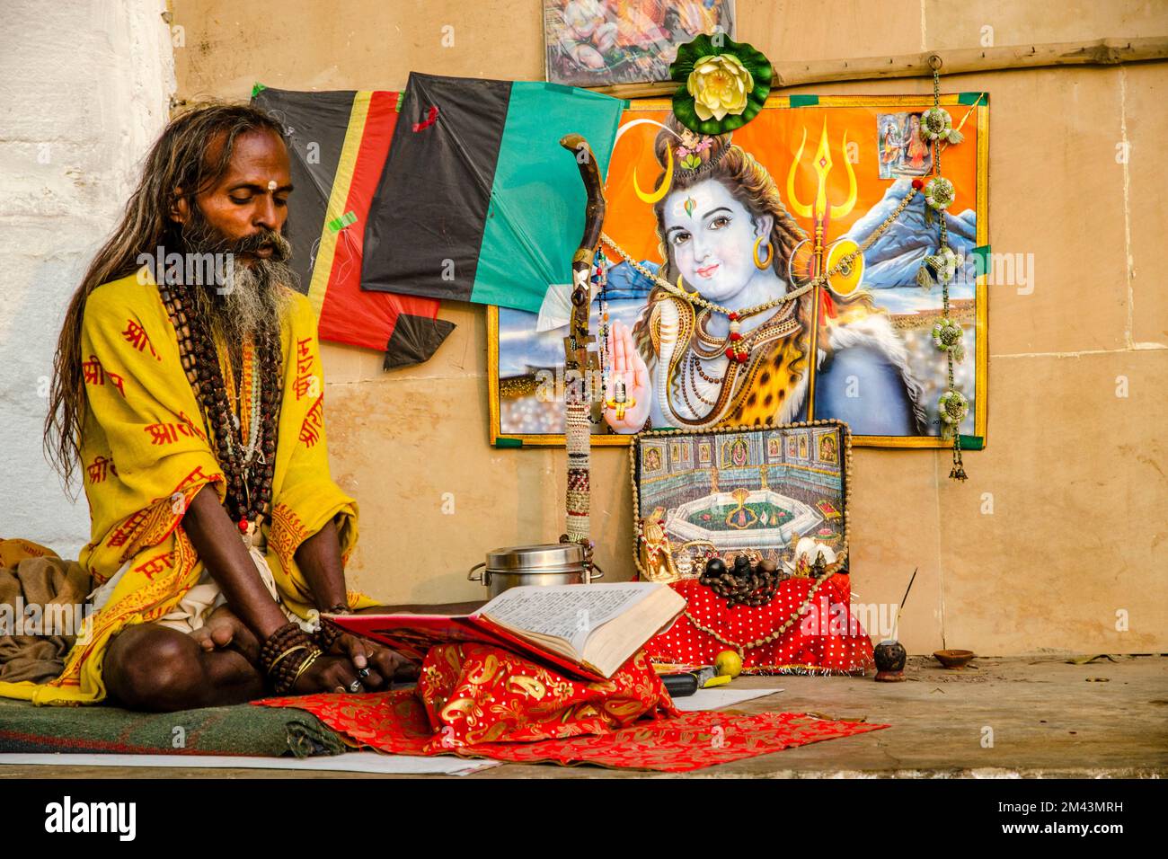 Chanting Sadhu reciting from the holy books in the morning at the ghats ...