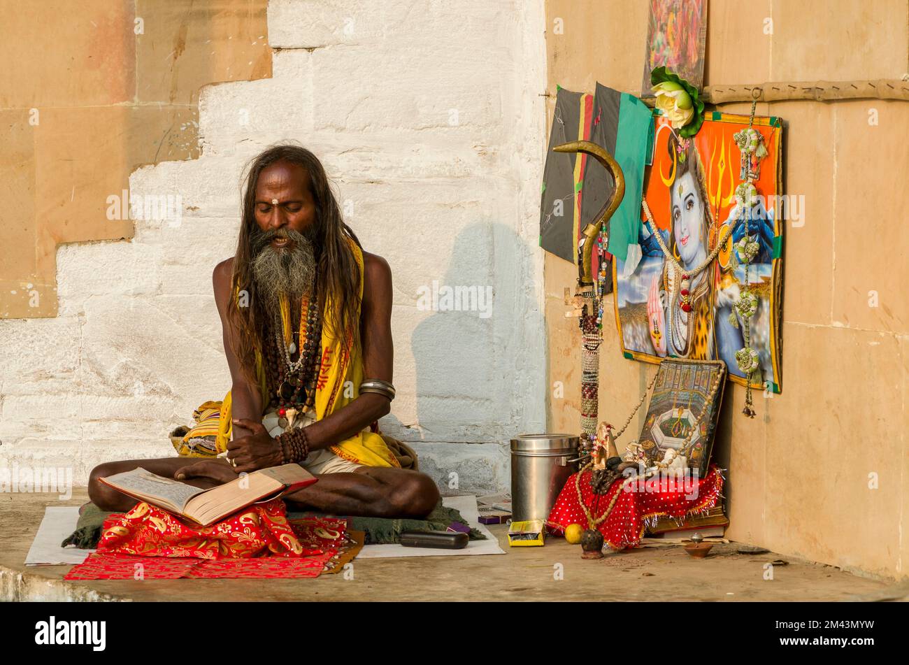 Chanting Sadhu reciting from the holy books in the morning at the ghats ...