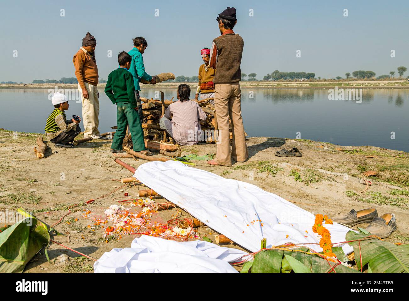 Group of people watching the cremation ceremony of a family members on ...
