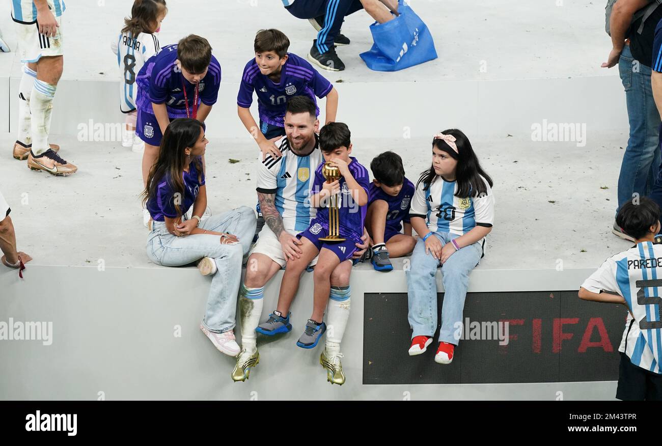 Argentina's Lionel Messi sits with family members after the FIFA World ...