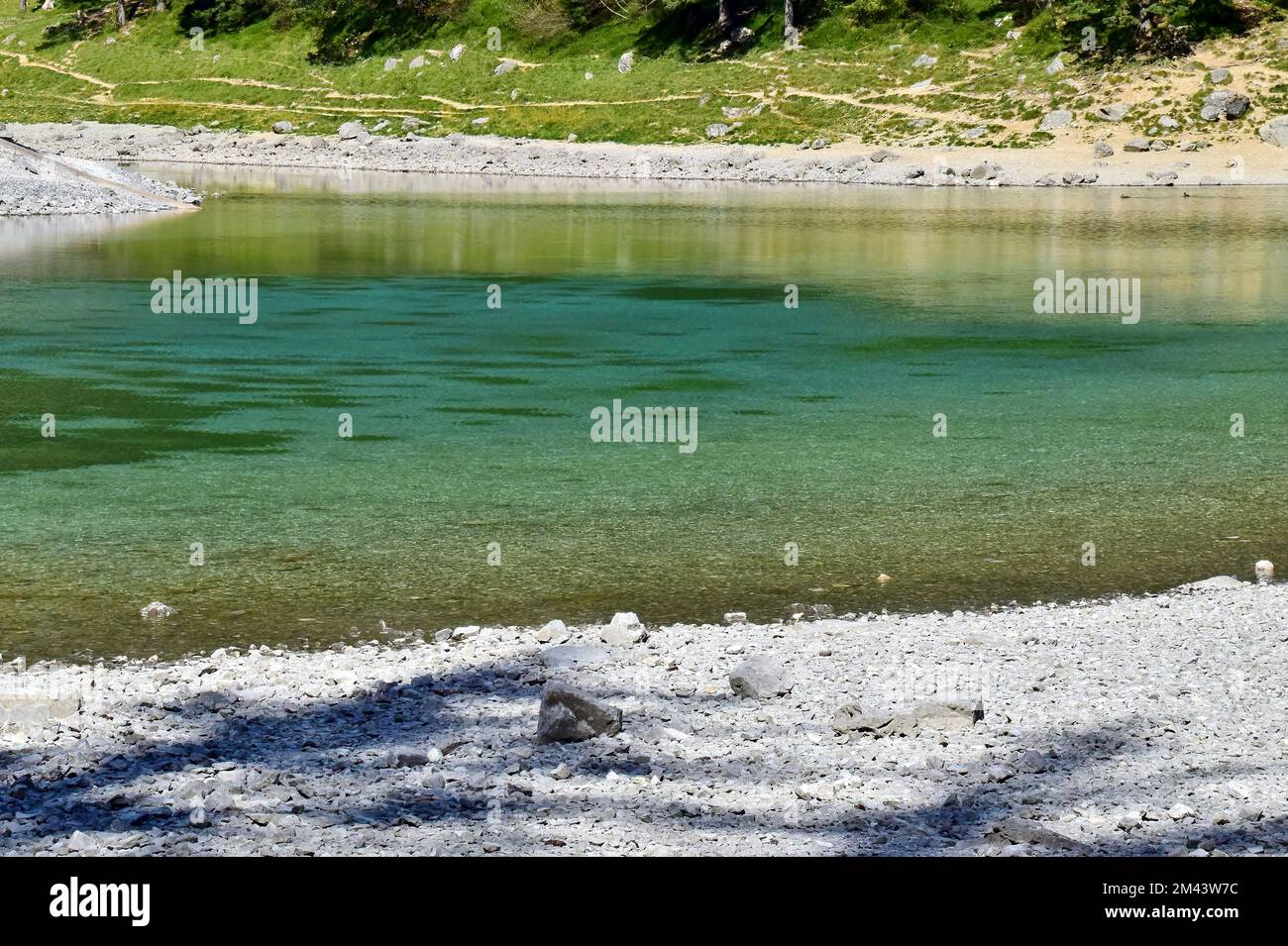 A landscape view of an empty beach with clear water Stock Photo - Alamy