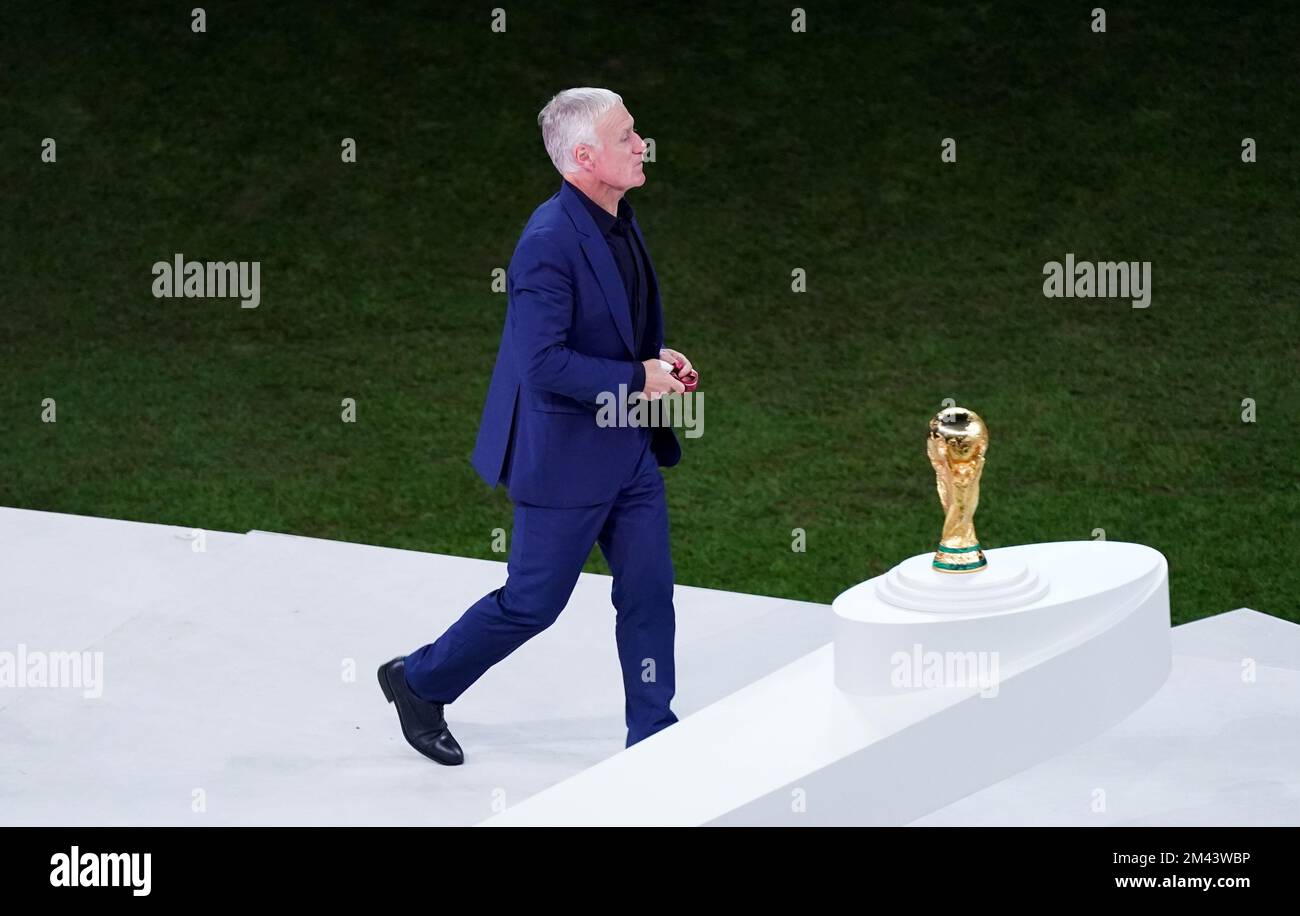 France manager Didier Deschamps walks past The World Cup Trophy after ...