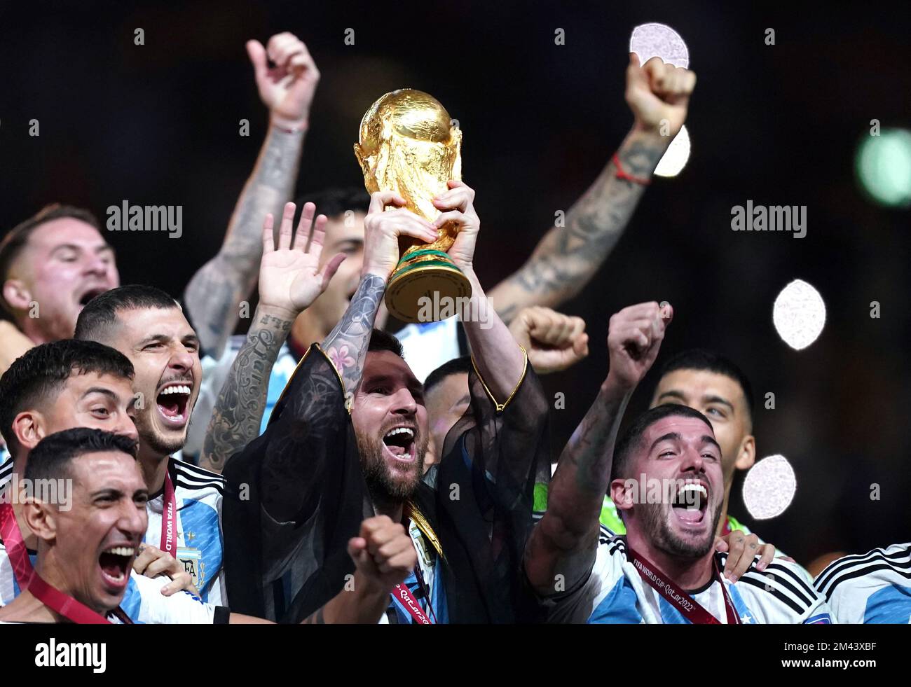 Argentina captain Lionel Messi lifts the FIFA World Cup trophy ...
