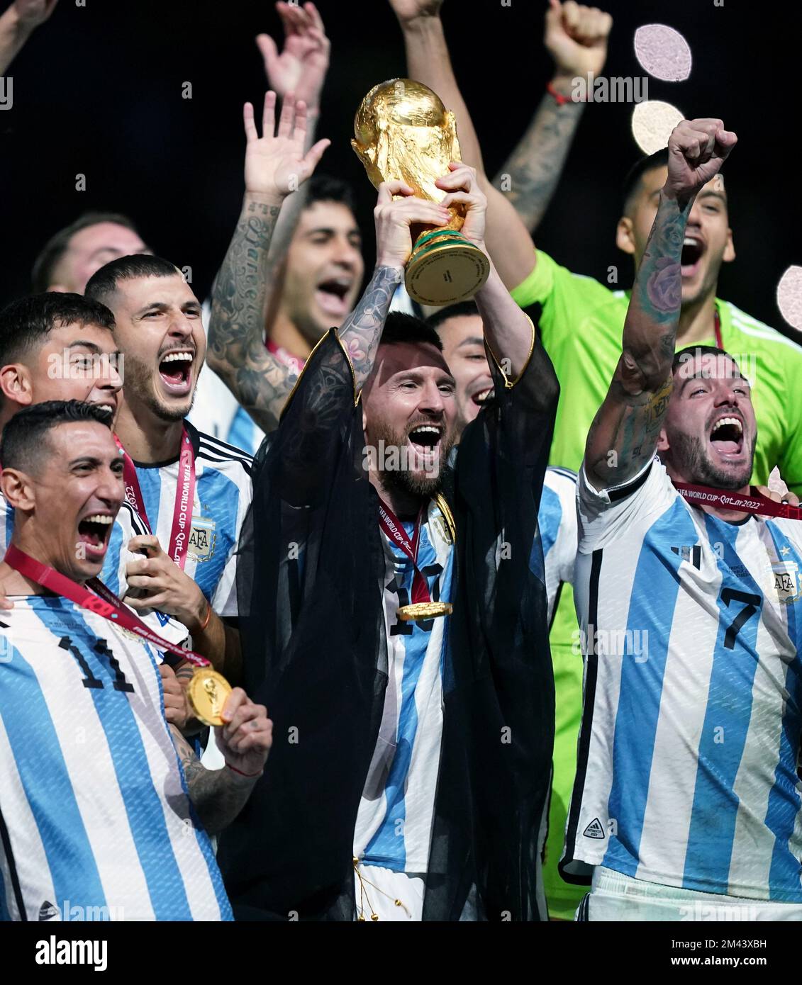 Argentina captain Lionel Messi lifts the FIFA World Cup trophy ...