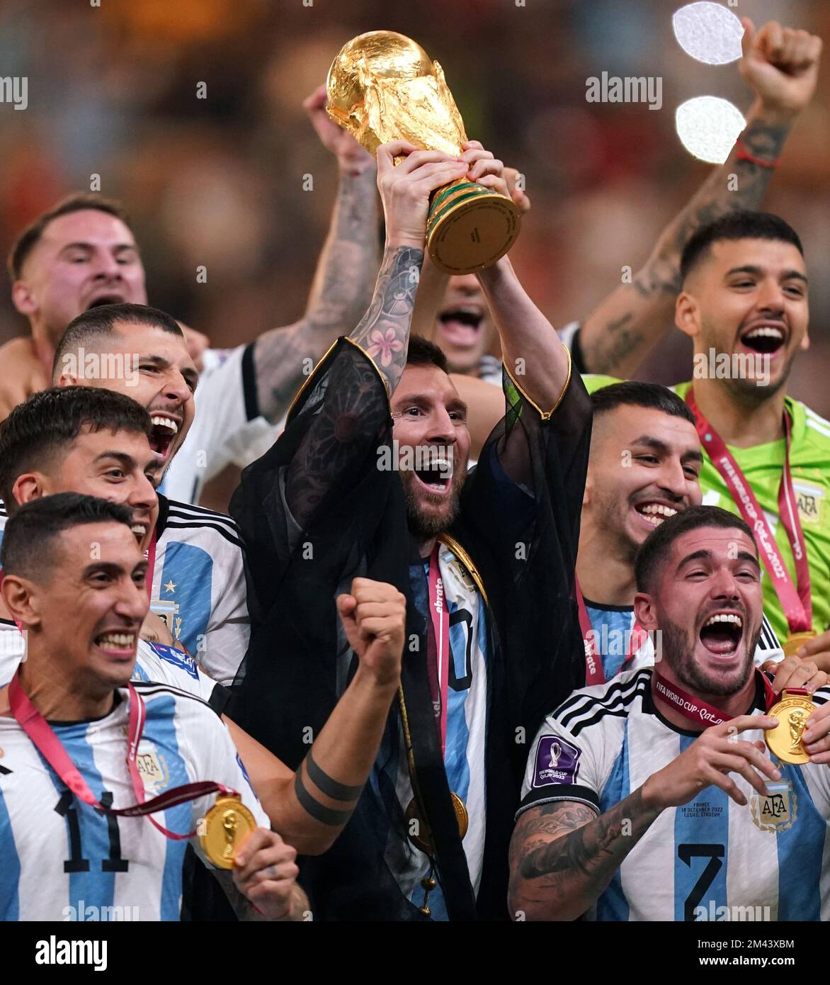 Argentina captain Lionel Messi lifts the FIFA World Cup trophy ...