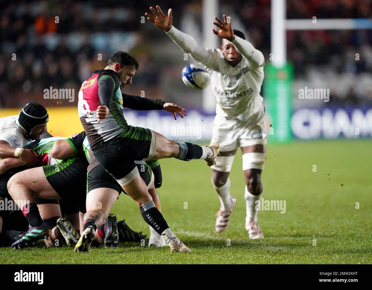 Harlequins' Danny Care performs a box kick during the Heineken ...
