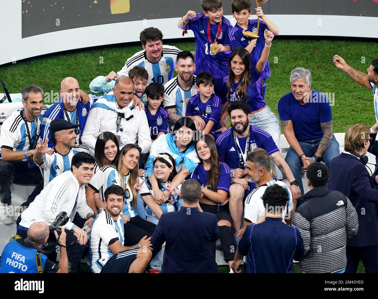 Argentina's Lionel Messi sits with family members after the FIFA World ...