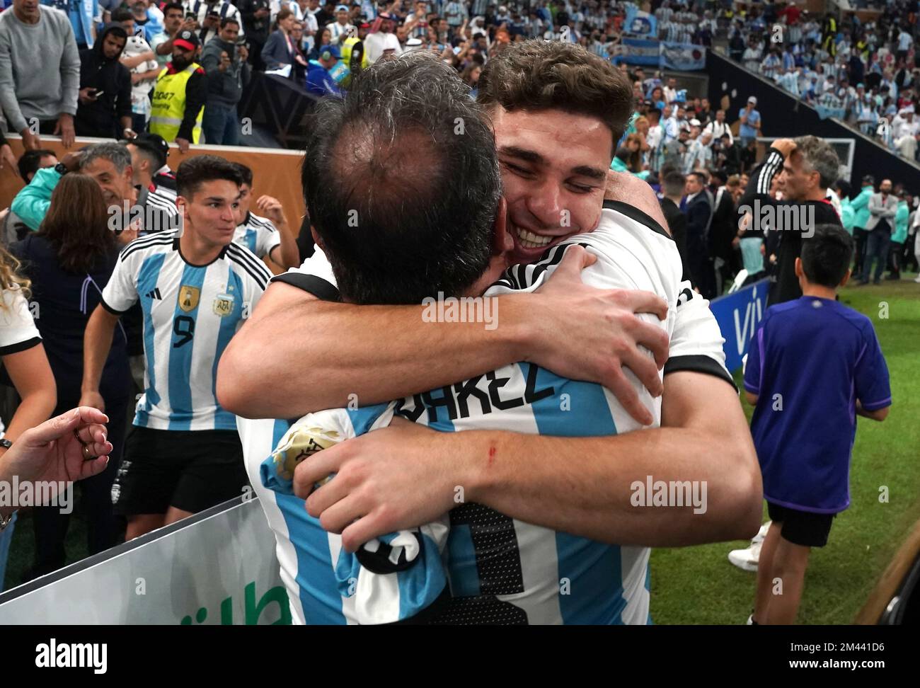 Argentina's Julian Alvarez (right) celebrates with his father following ...