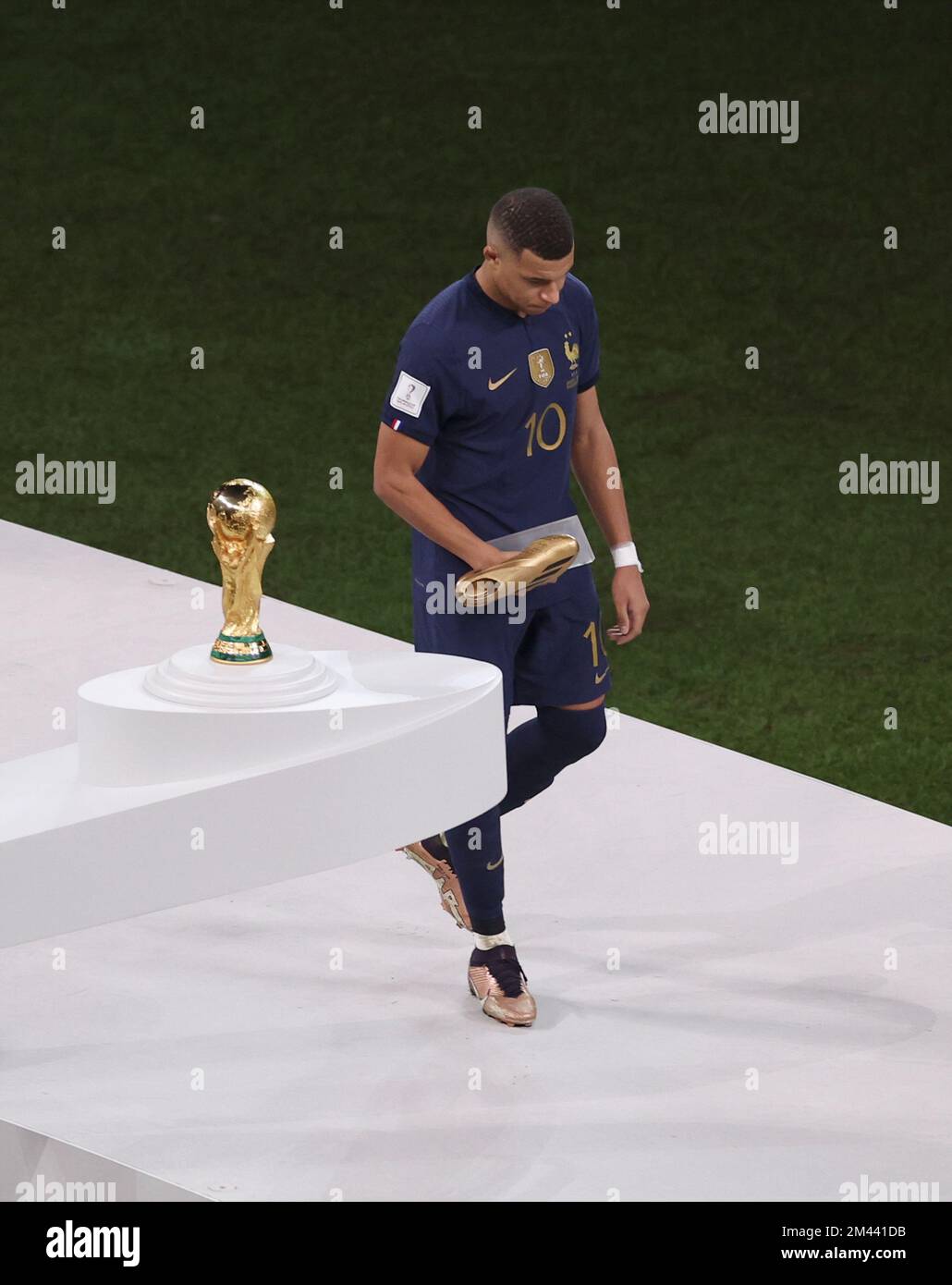 Lusaier, Qatar. 18th Dec, 2022. Kylian Mbappe walks pass the FIFA World ...