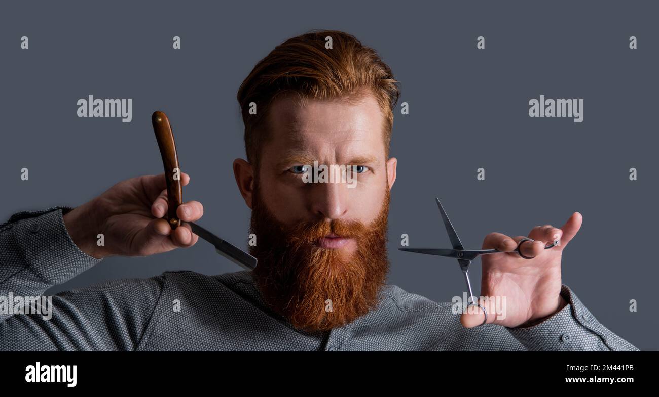 portrait of barber man has hairstyle in studio. barber man hold ...