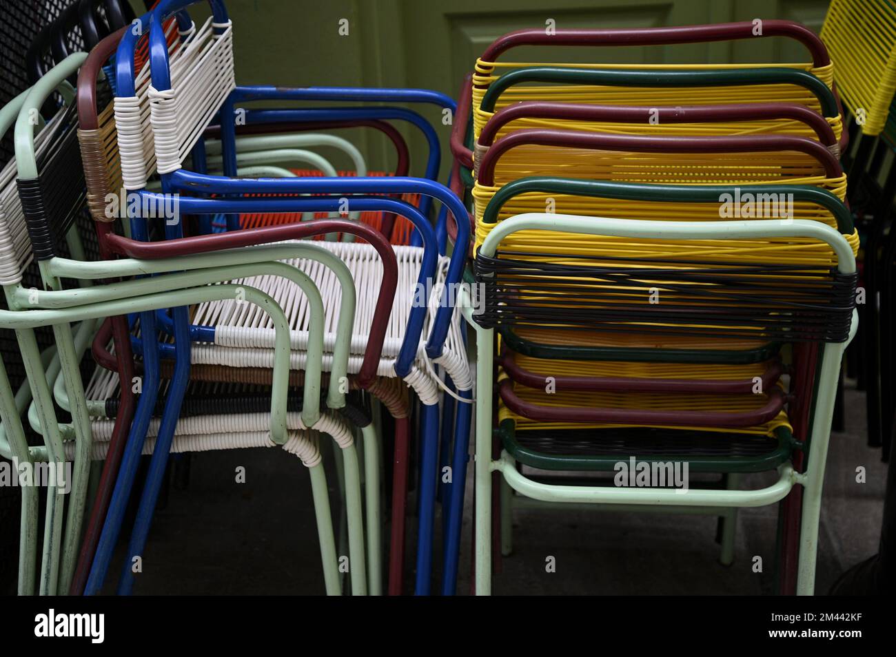 Colorful outdoor stackable metal chairs Stock Photo - Alamy