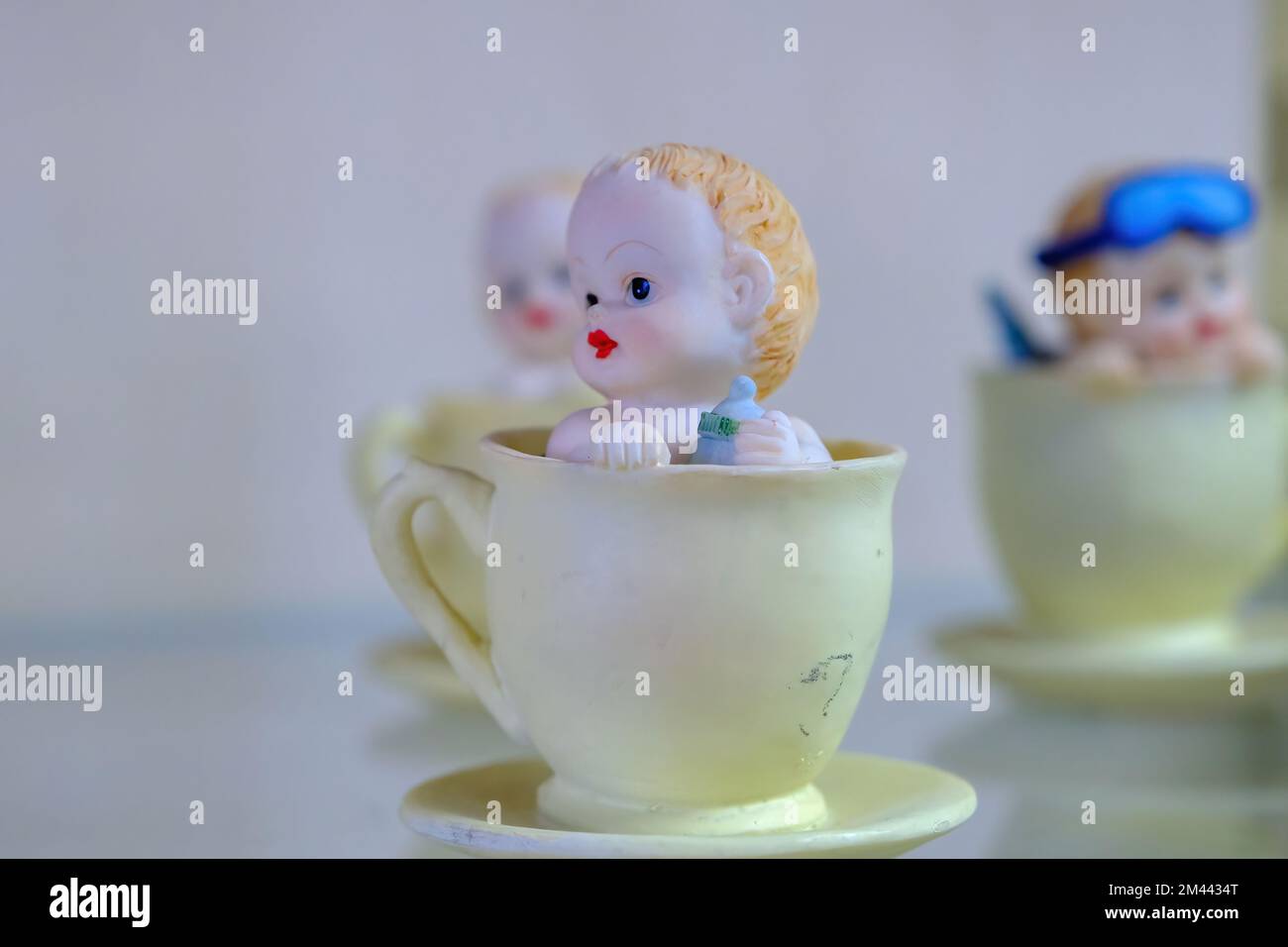 A historical porcelain figurine. porcelain cup little porcelain child ...