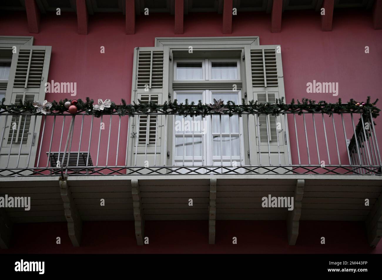 Festive Christmas garland decorations with colorful baubles on the ...