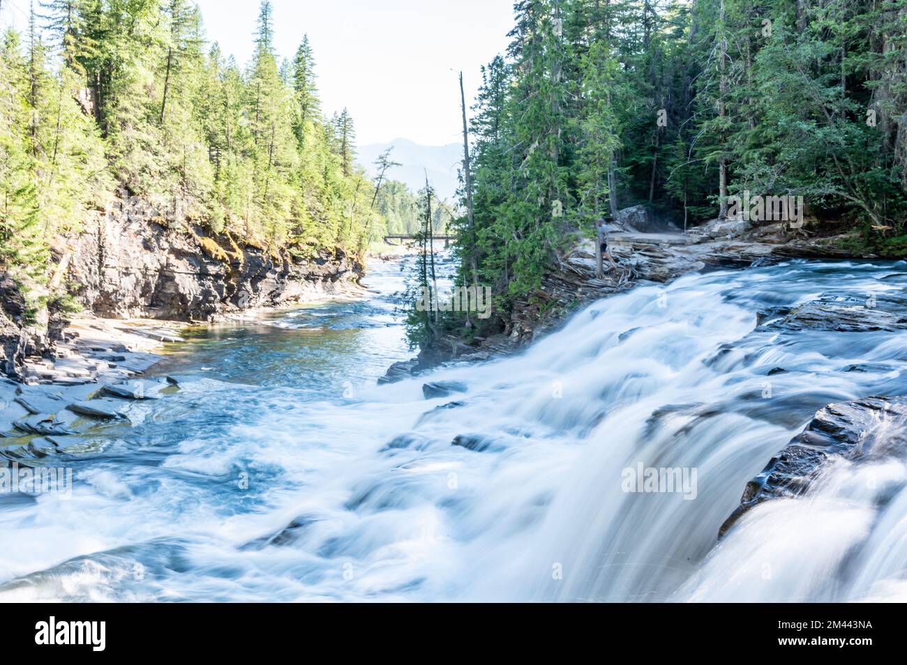 Cascades and rushing water in Avalanche Creek at Glacier National Park ...