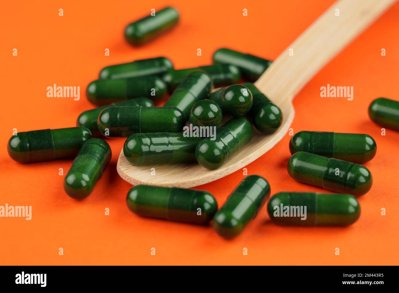 Green supplement capsules of alternative dietary herbal medicine with ...