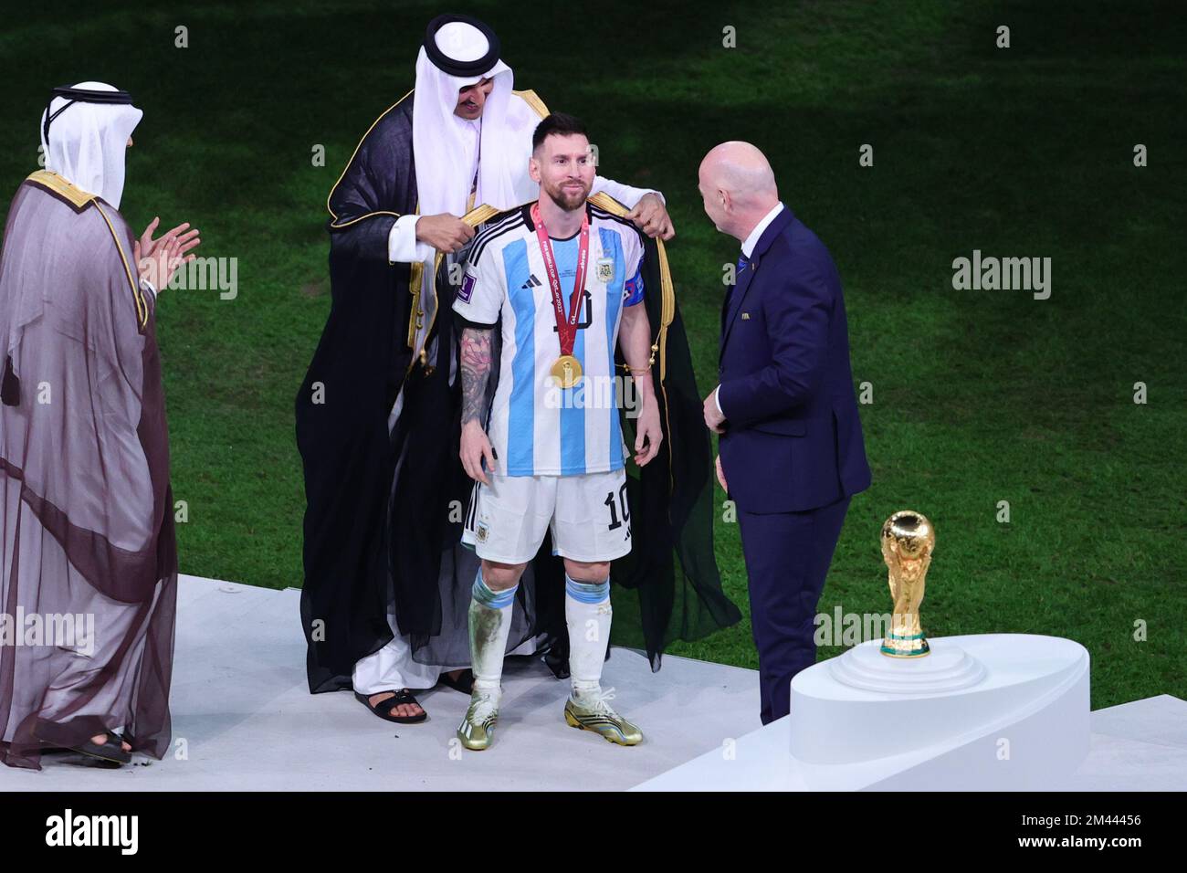 Lusail, Qatar. 18th Dec, 2022. Lionel Messi of Argentina is gifted a ...