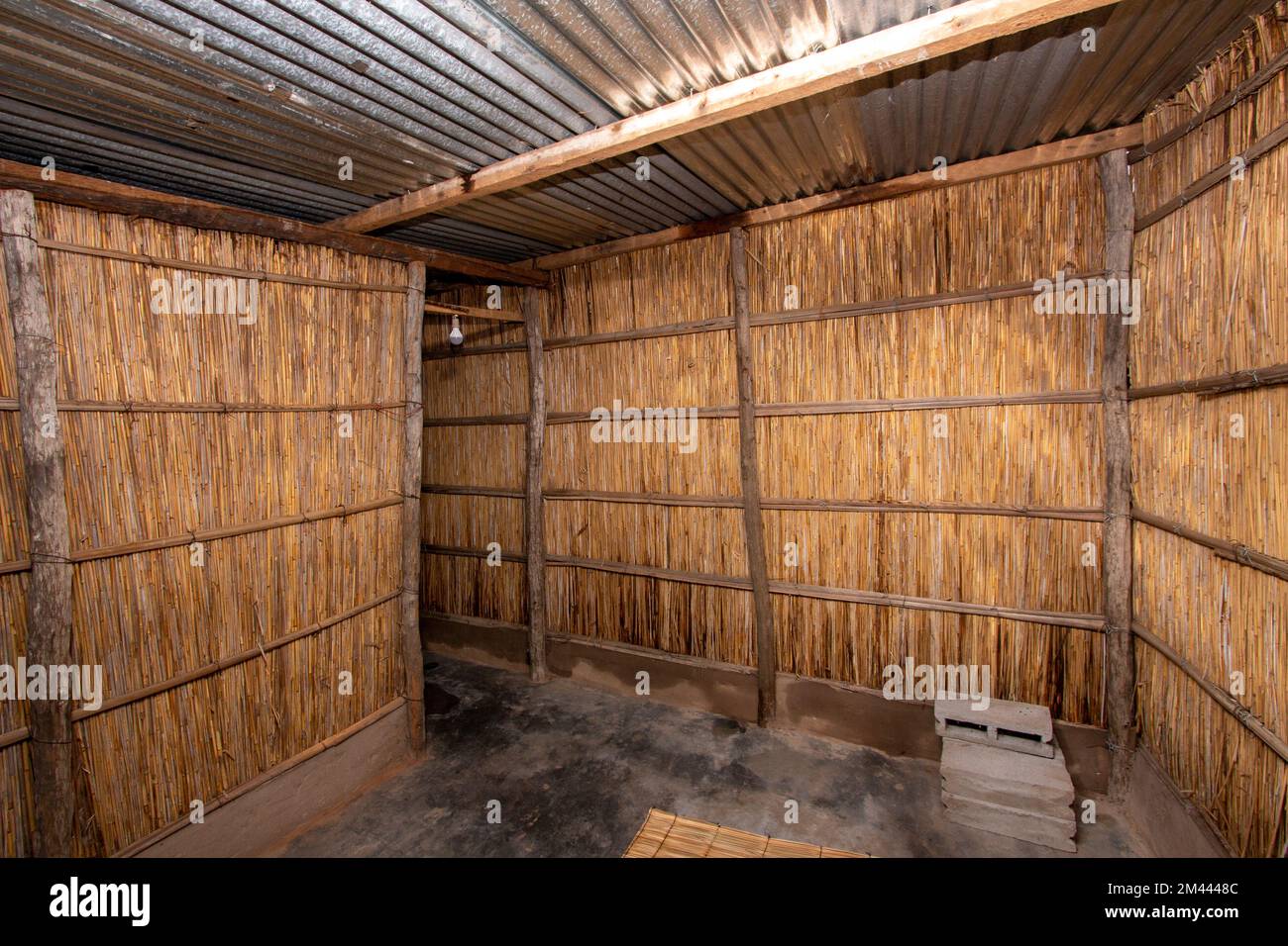Interior view of a reed house, common in some parts of Africa, with ...