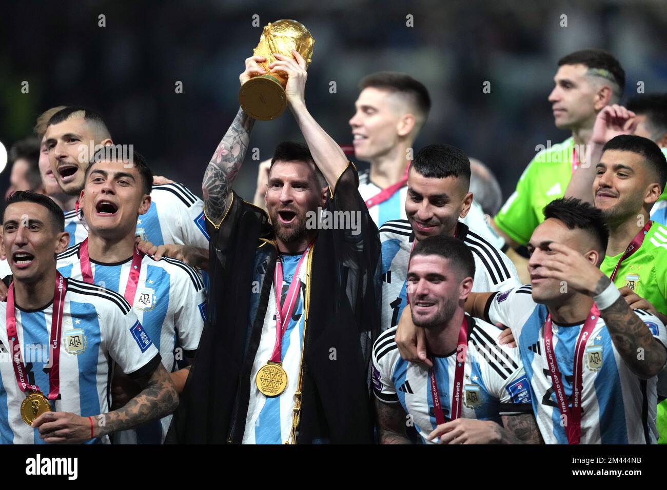 Argentina captain Lionel Messi lifts the FIFA World Cup trophy ...