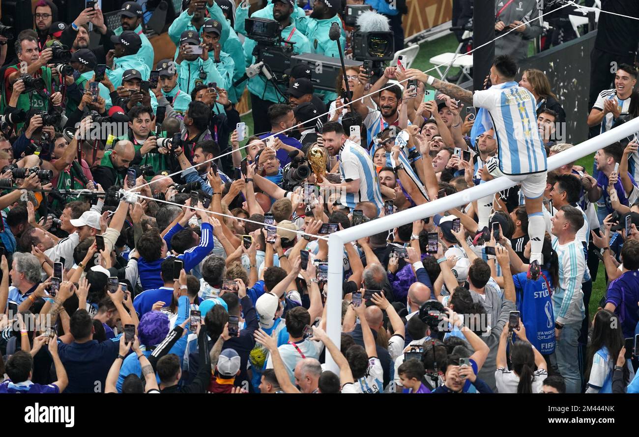 Argentina captain Lionel Messi lifts the FIFA World Cup trophy ...