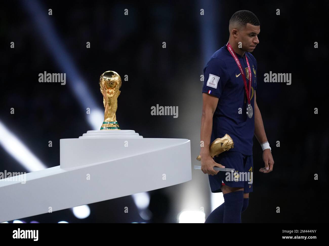 Golden Boot winner, France's Kylian Mbappe looks dejected as he walks ...