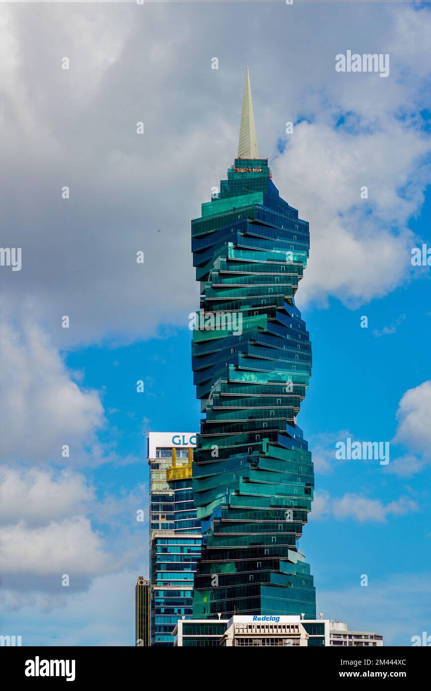 screw shaped skyscraper with blue glass windows, as background blue sky ...